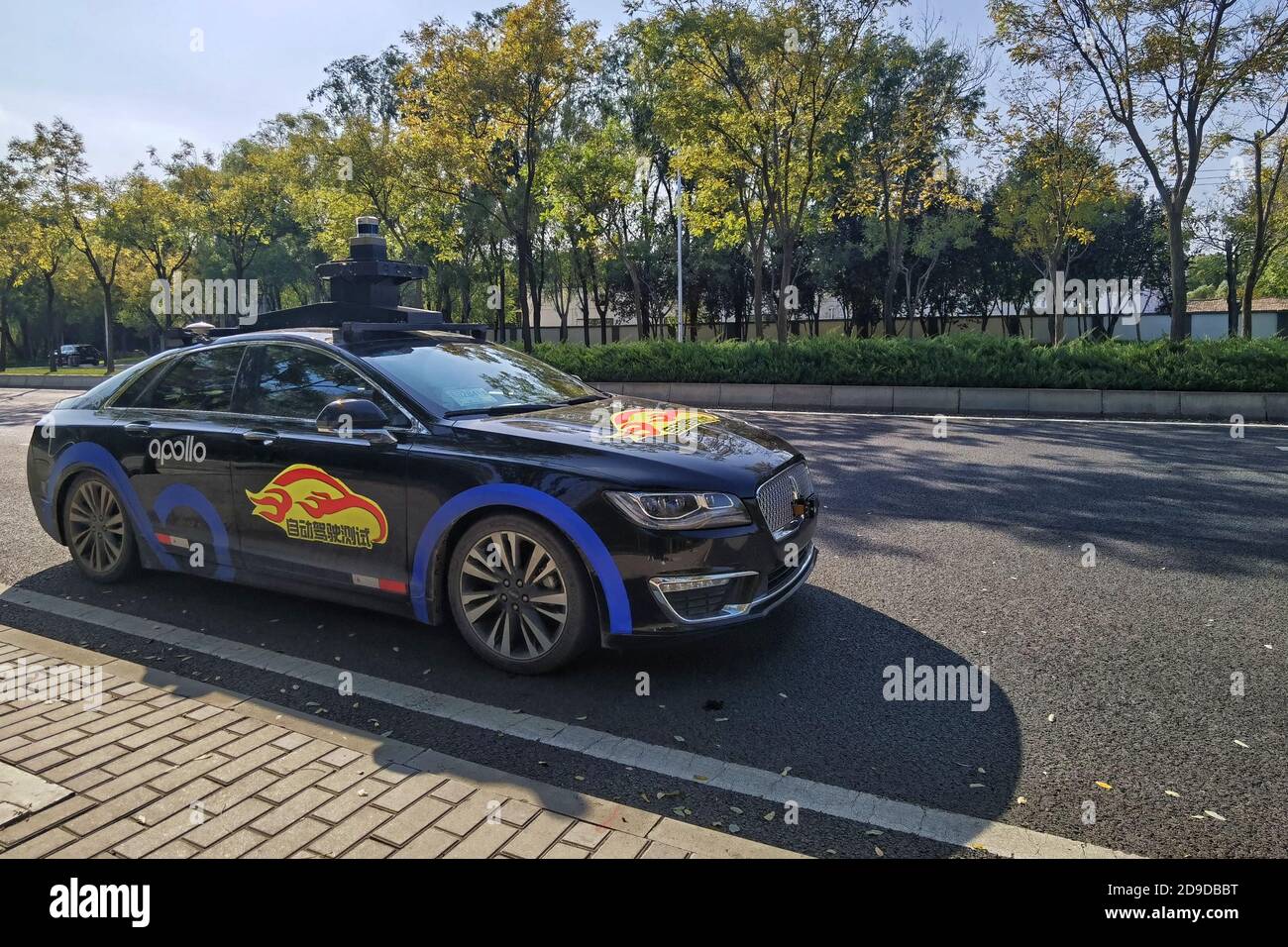 An Apollo Go Robotaxi drives on a road in Beijing, China, 14 OCtober ...