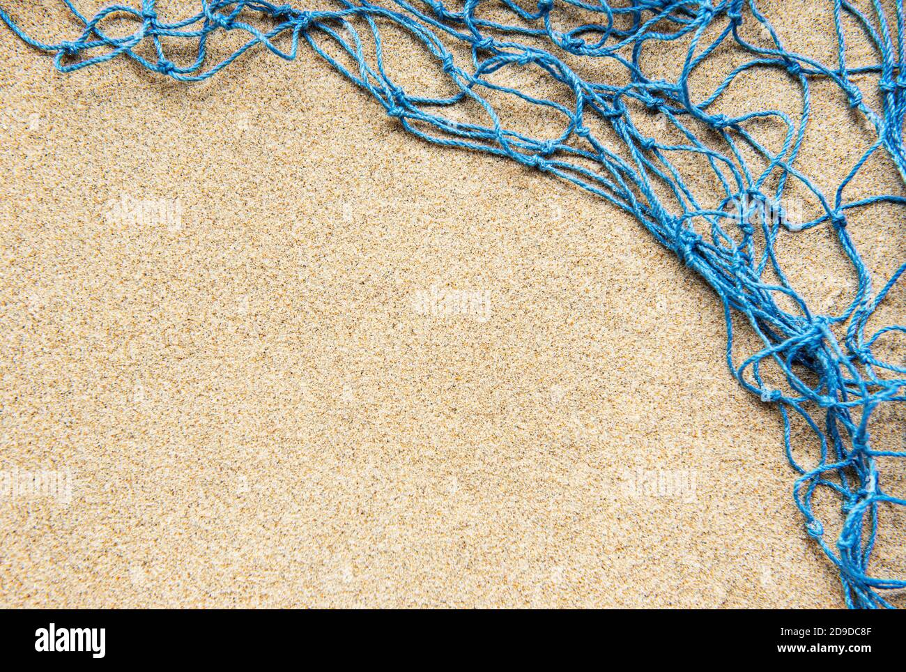 Blue Fishing net on a beach sand, travel, holiday concept Stock Photo ...