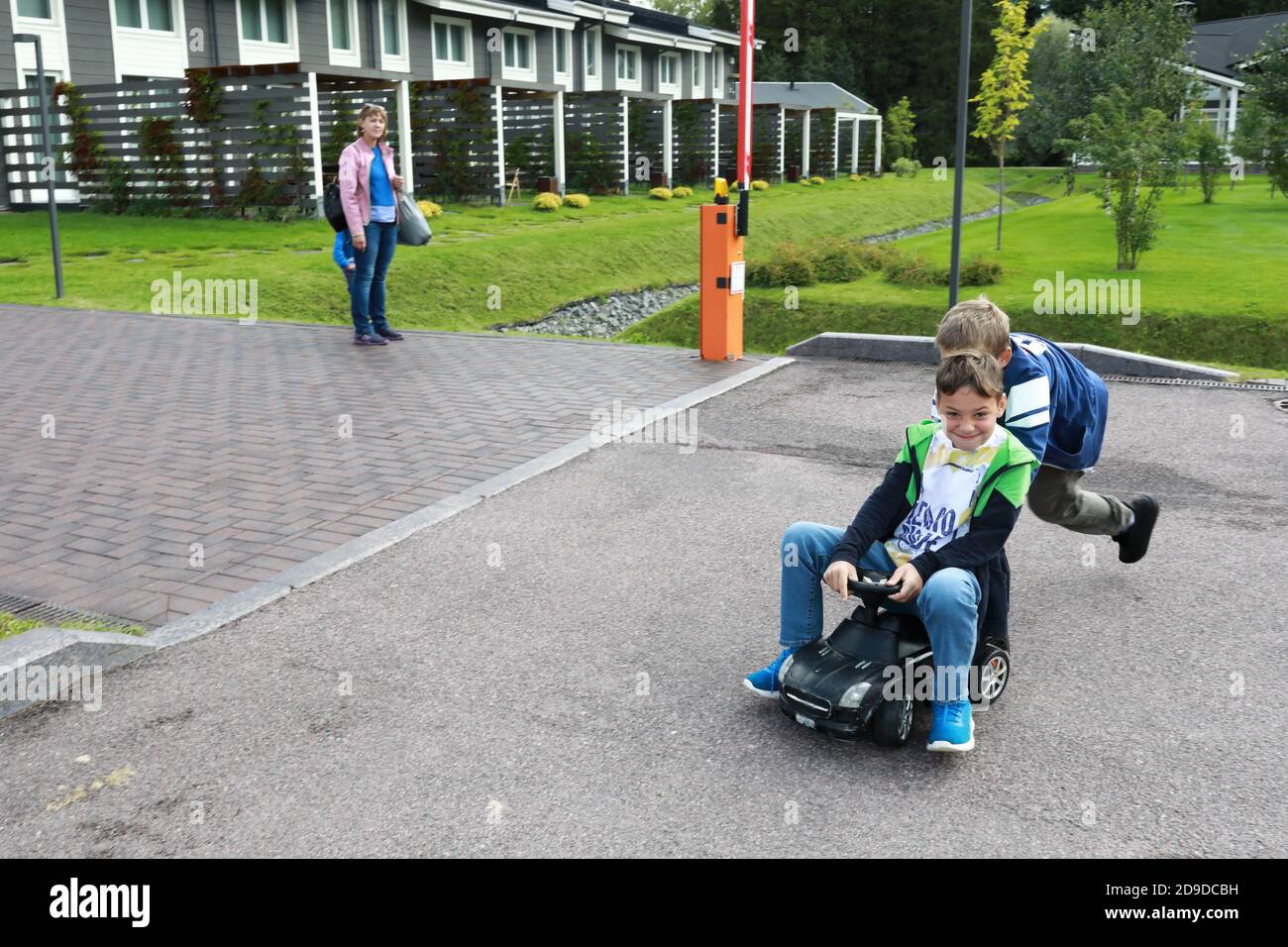 Children pushing toy car hi-res stock photography and images - Alamy