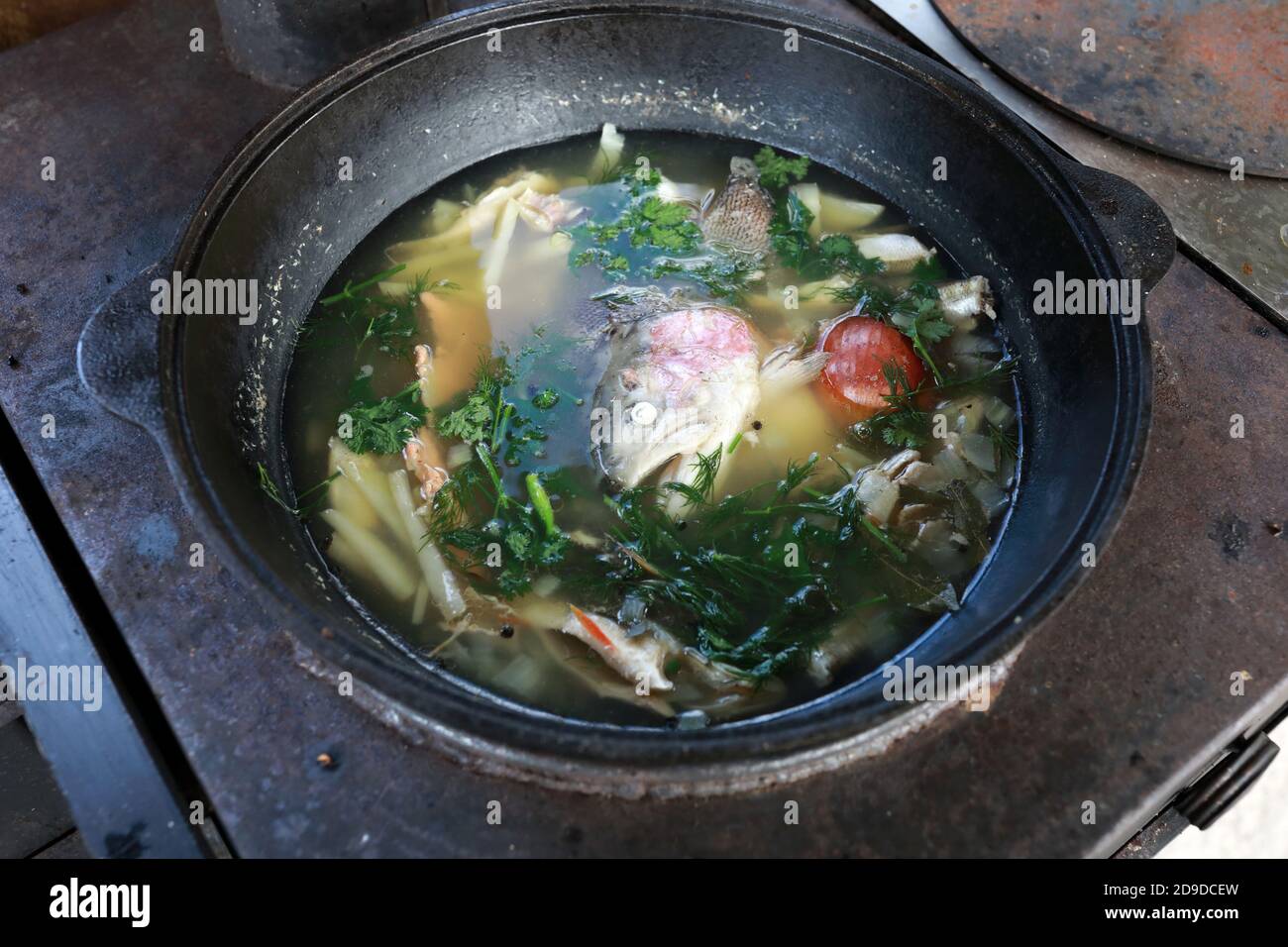 Cooking of Traditional Russian Fish Soup in cauldron Stock Photo - Alamy