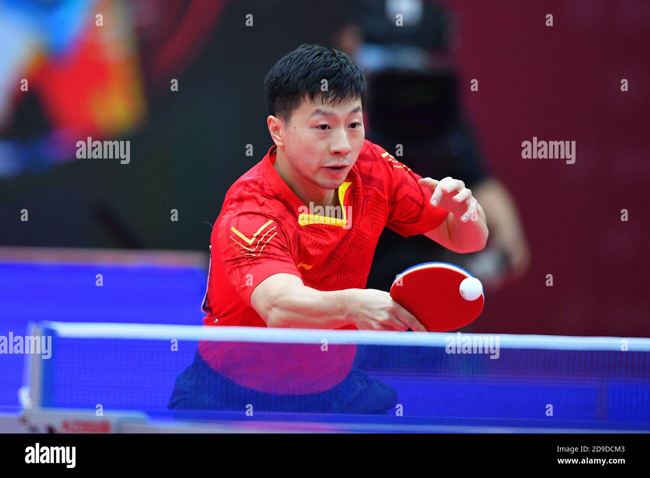 Chinese table tennis player Ma Long competes against Chinese table ...