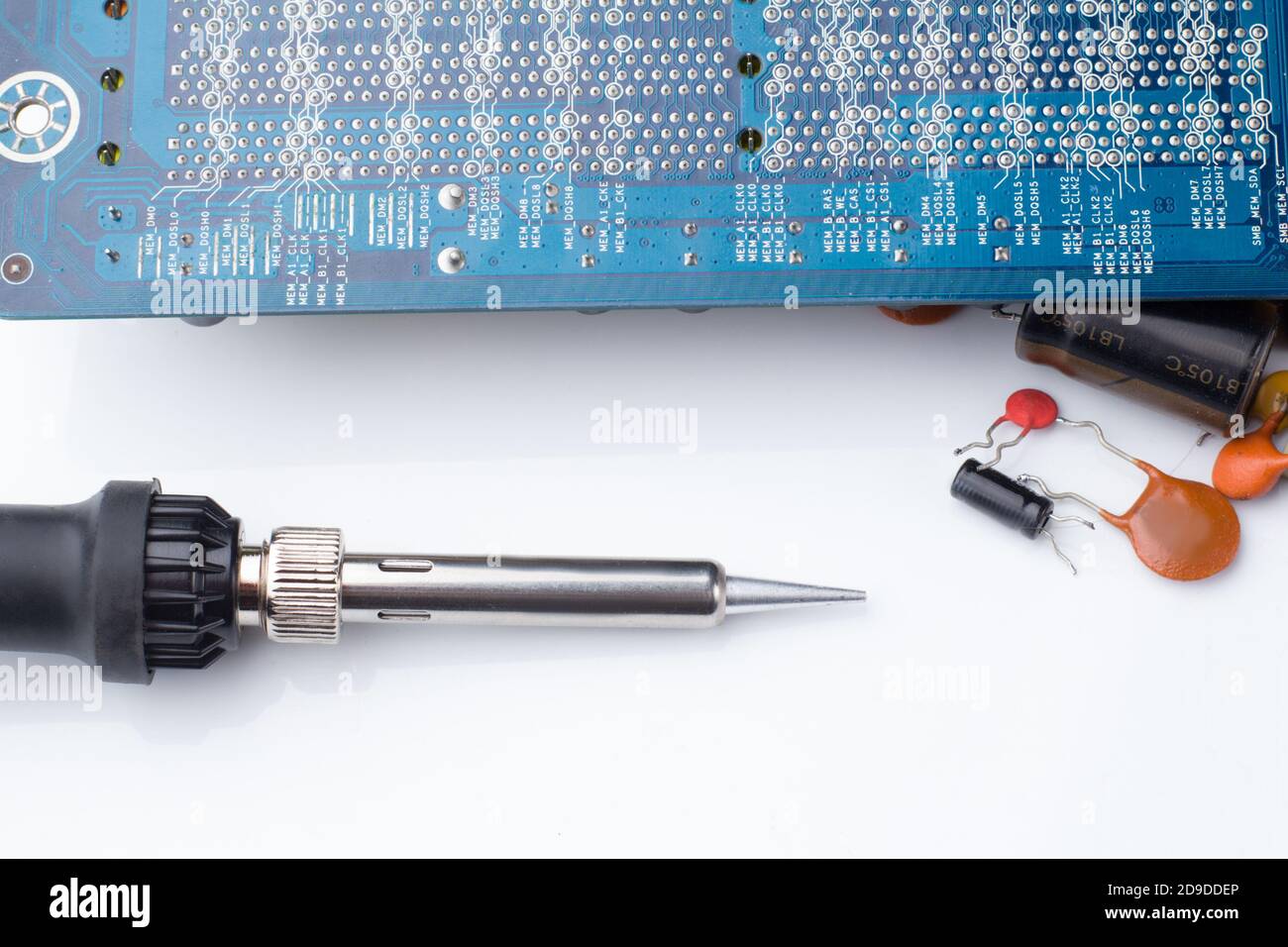 soldering iron , computer Board and capacitors. The concept of repair ...