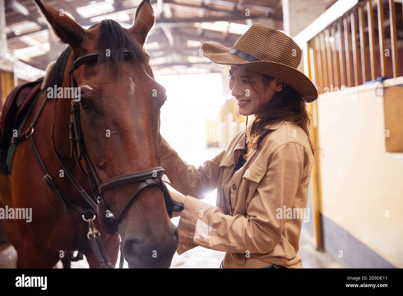 The stable of young women and horses Stock Photo - Alamy