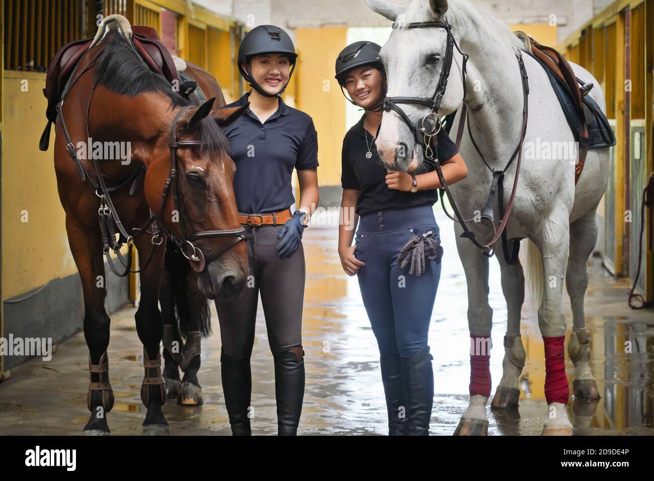 The horse stable happy sisters Stock Photo - Alamy