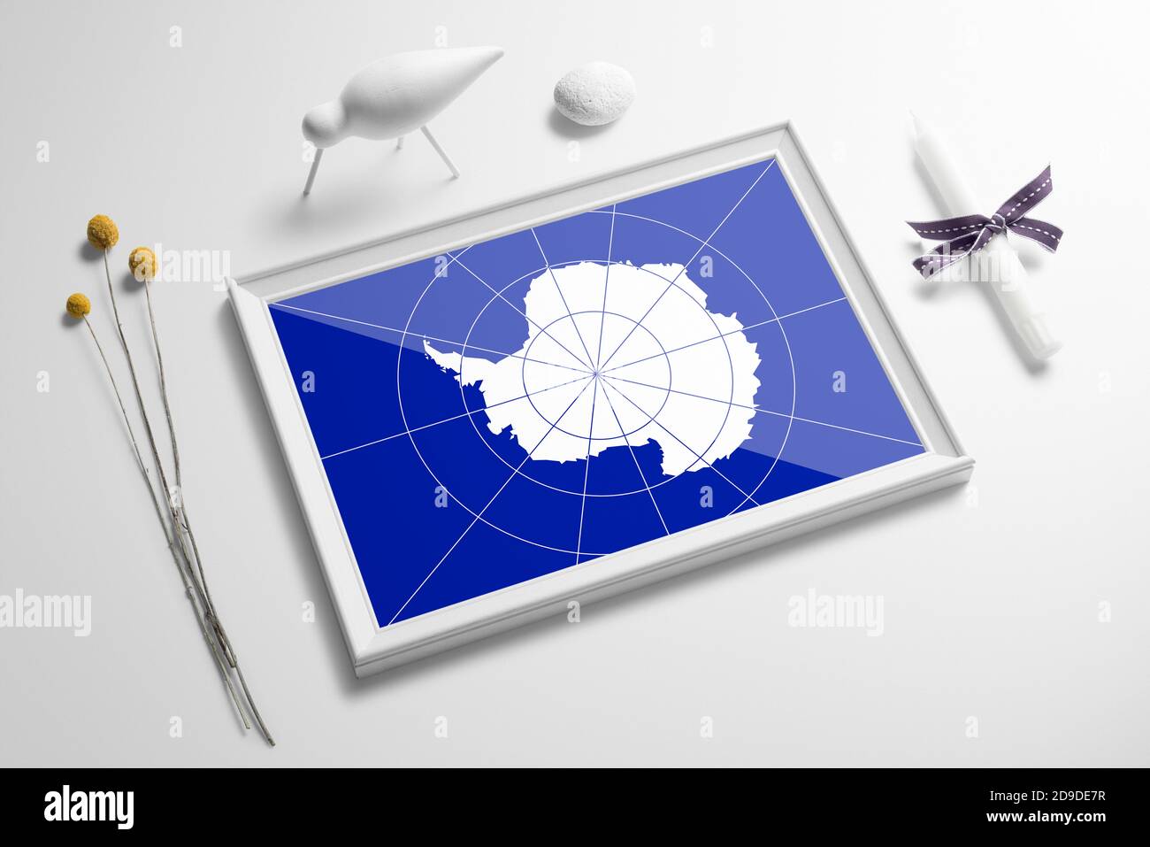 Antarctica flag in wooden frame on table. White natural soft concept ...