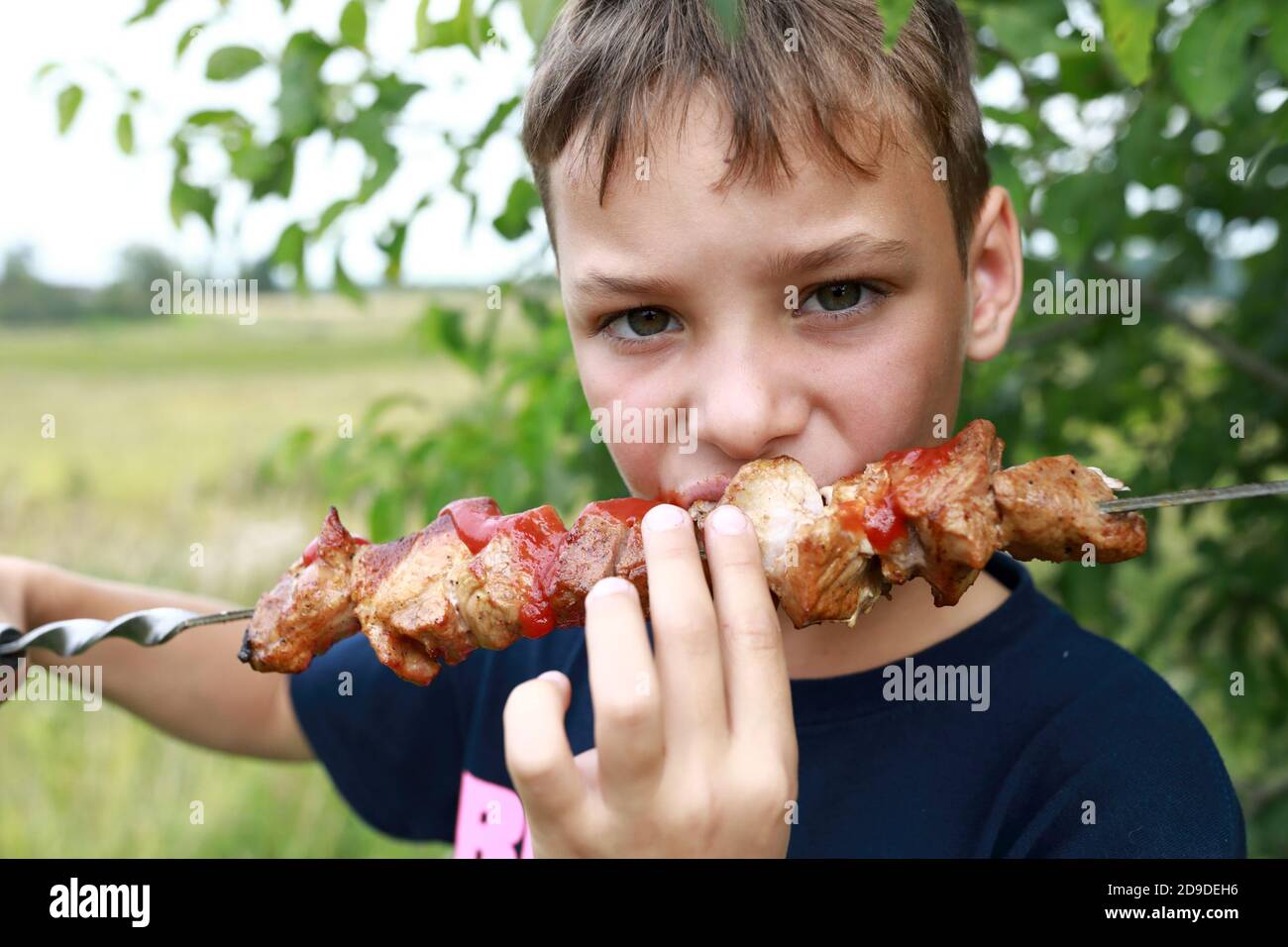 Child eating pork meat hi-res stock photography and images - Alamy