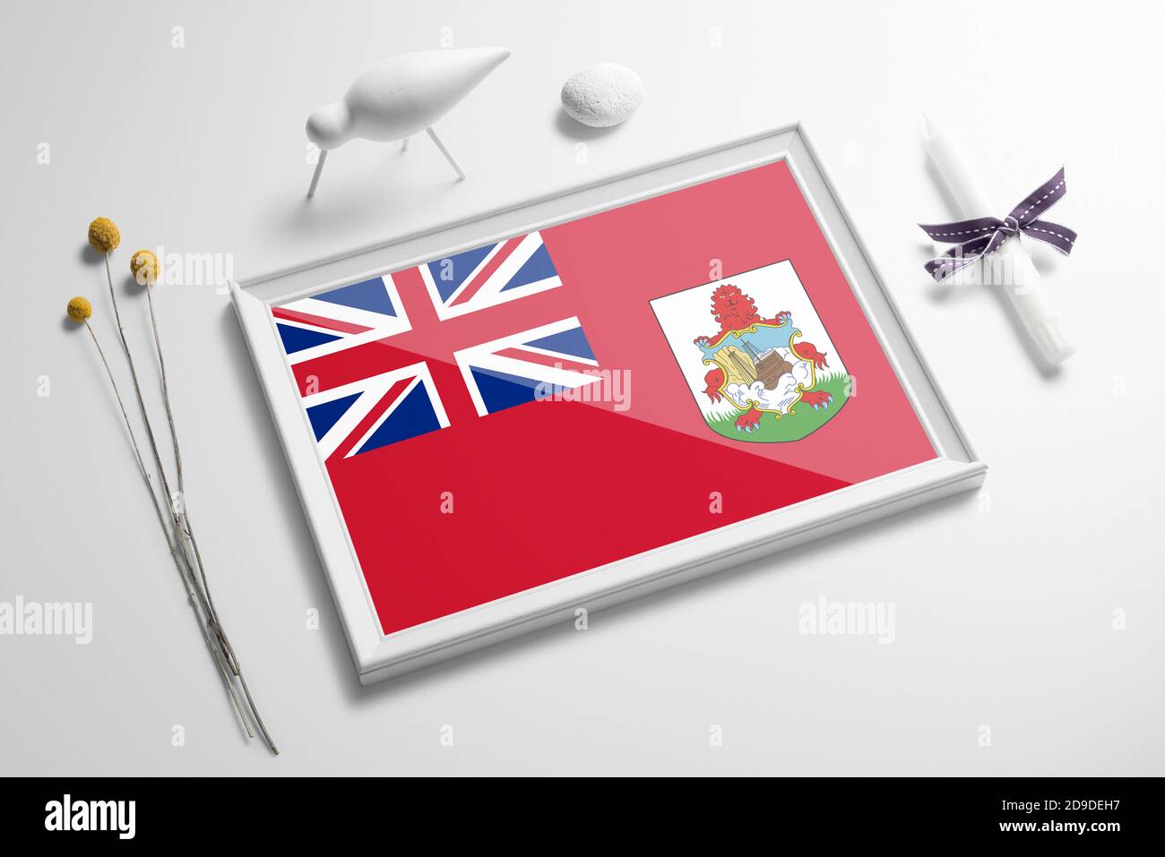 Bermuda flag in wooden frame on table. White natural soft concept ...