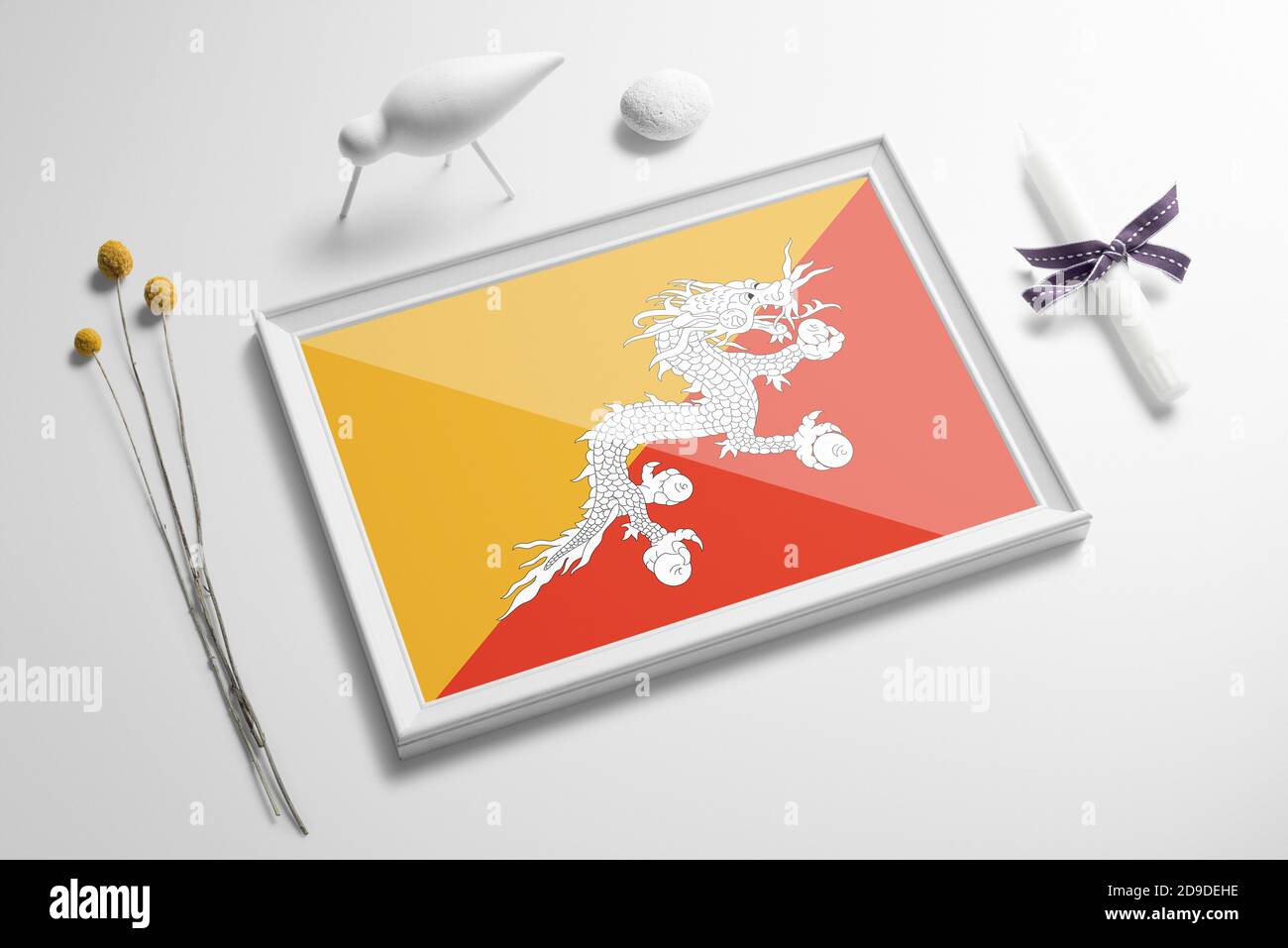 Bhutan flag in wooden frame on table. White natural soft concept ...