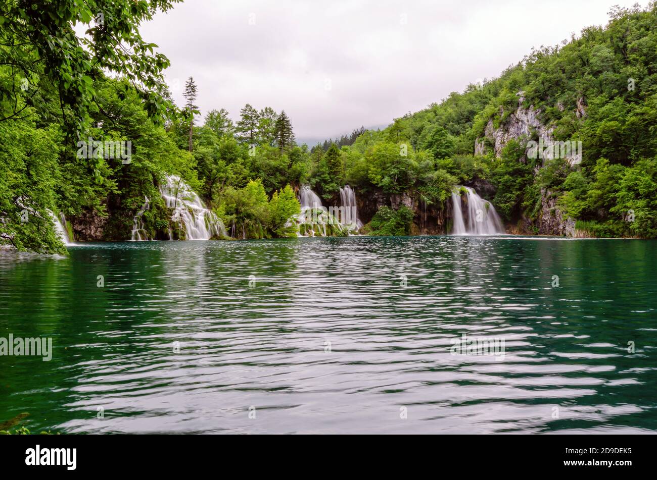 Beautiful waterfall and blue limpid lake in Plitvice Lakes National ...