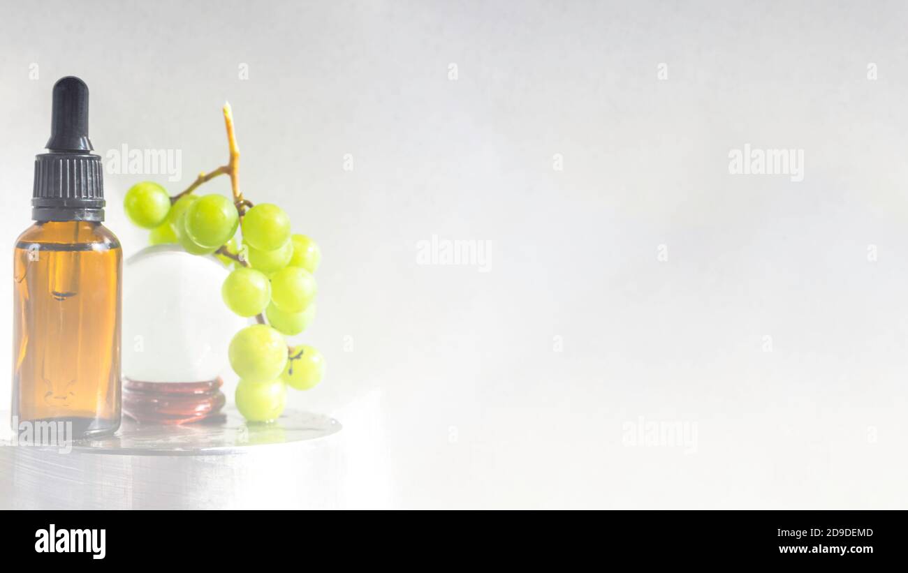 Grape seed oil in glass bottle with fresh grape, Pure essential skin ...