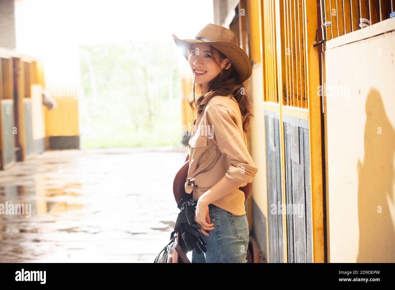 The stable with the beautiful young women of the saddle Stock Photo - Alamy
