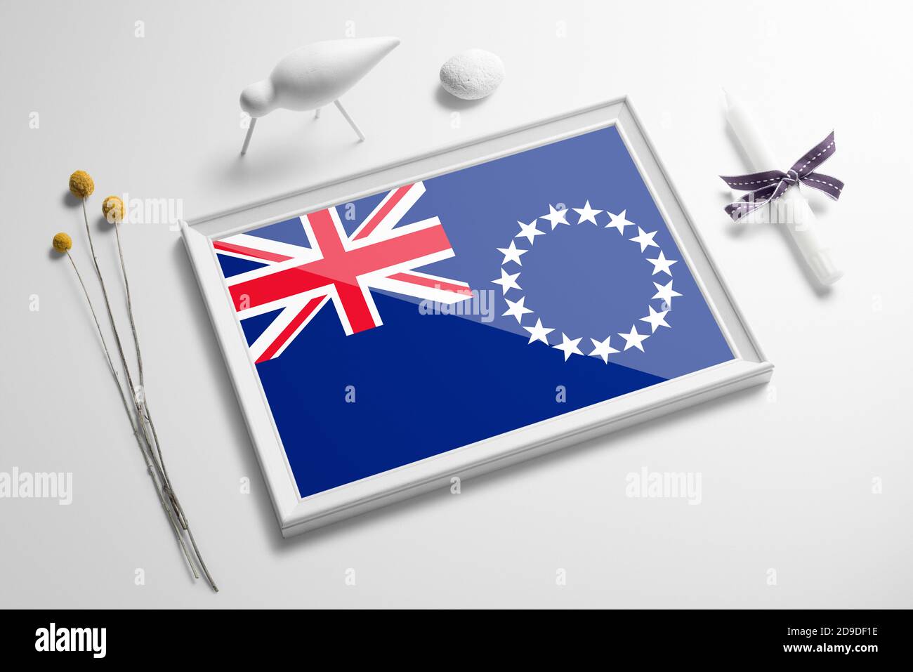 Cook Islands flag in wooden frame on table. White natural soft concept ...