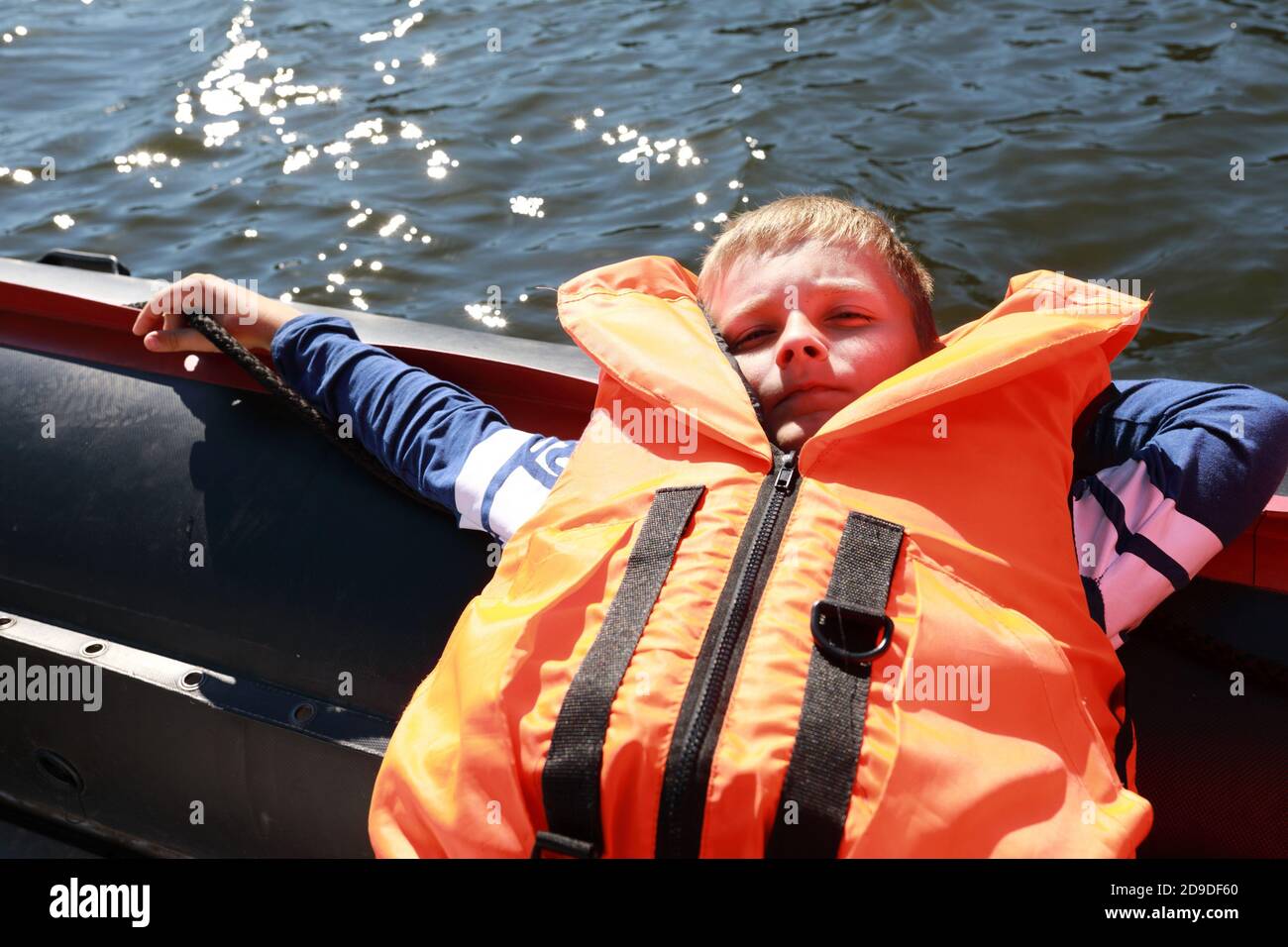 Boy life vest floating hi-res stock photography and images - Alamy