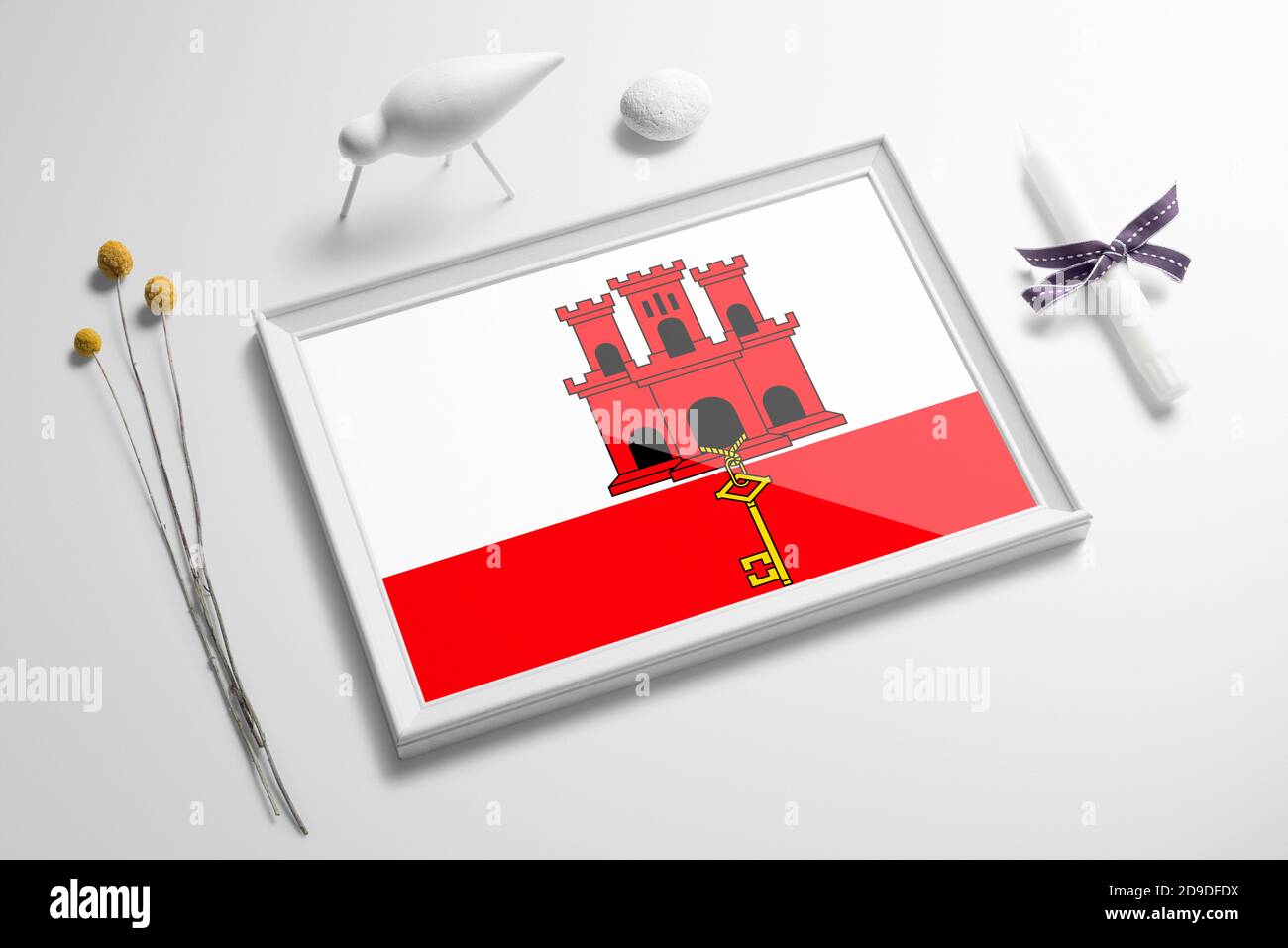 Gibraltar flag in wooden frame on table. White natural soft concept ...