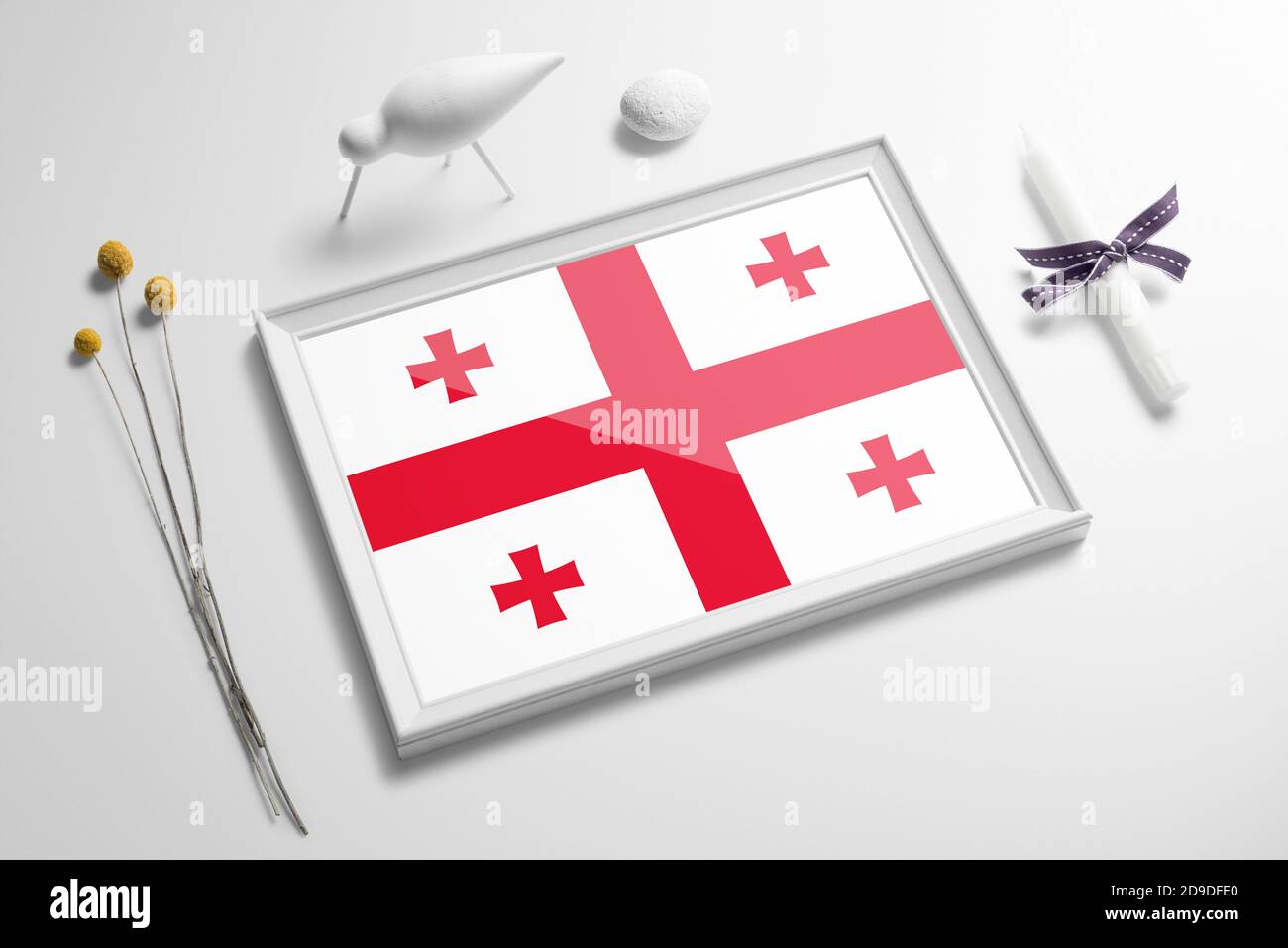 Georgia flag in wooden frame on table. White natural soft concept ...