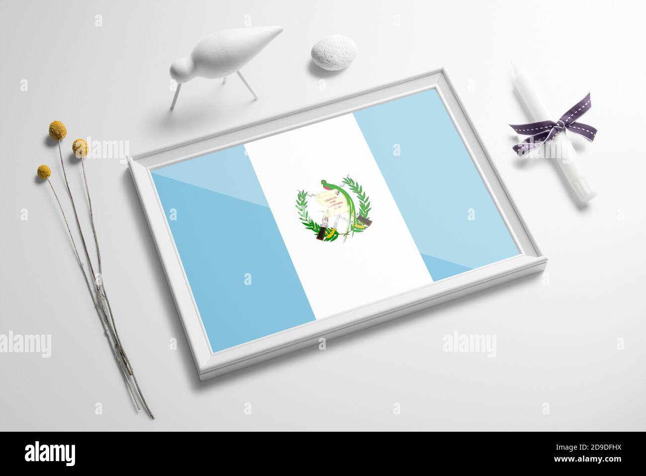 Guatemala flag in wooden frame on table. White natural soft concept ...