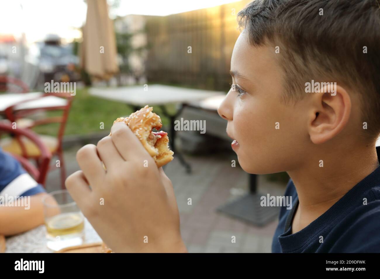 Fat kid eating burger hi-res stock photography and images - Alamy