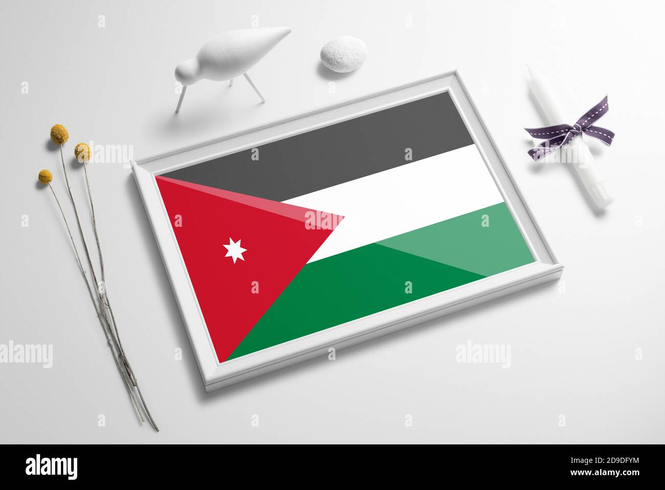 Jordan flag in wooden frame on table. White natural soft concept ...