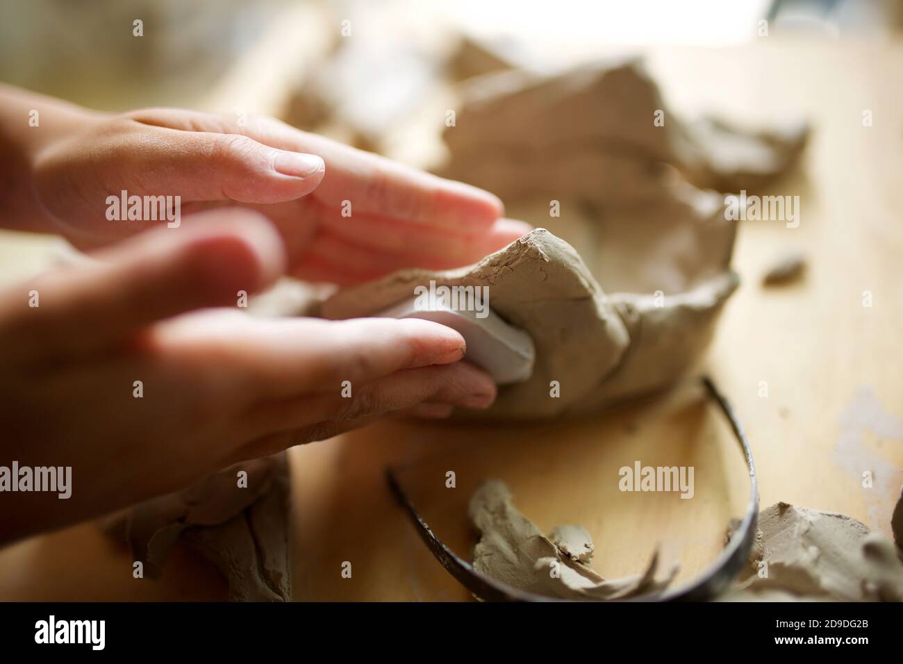Hands molding clay hi-res stock photography and images - Alamy
