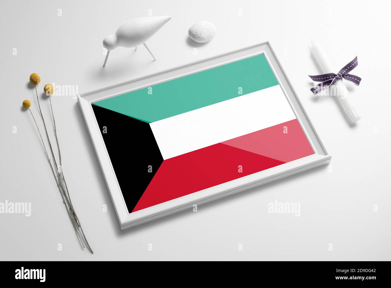 Kuwait flag in wooden frame on table. White natural soft concept ...