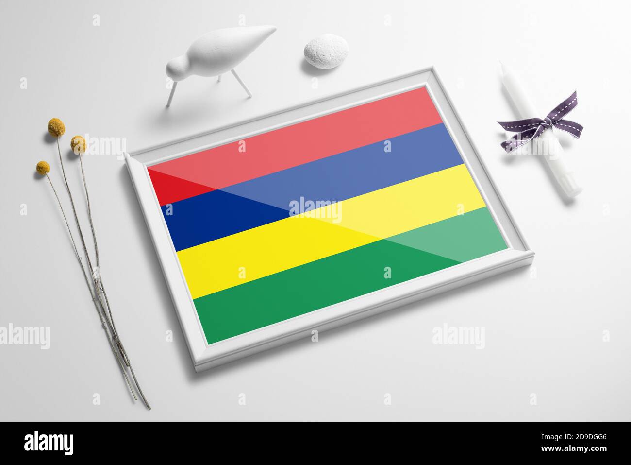 Mauritius flag in wooden frame on table. White natural soft concept ...