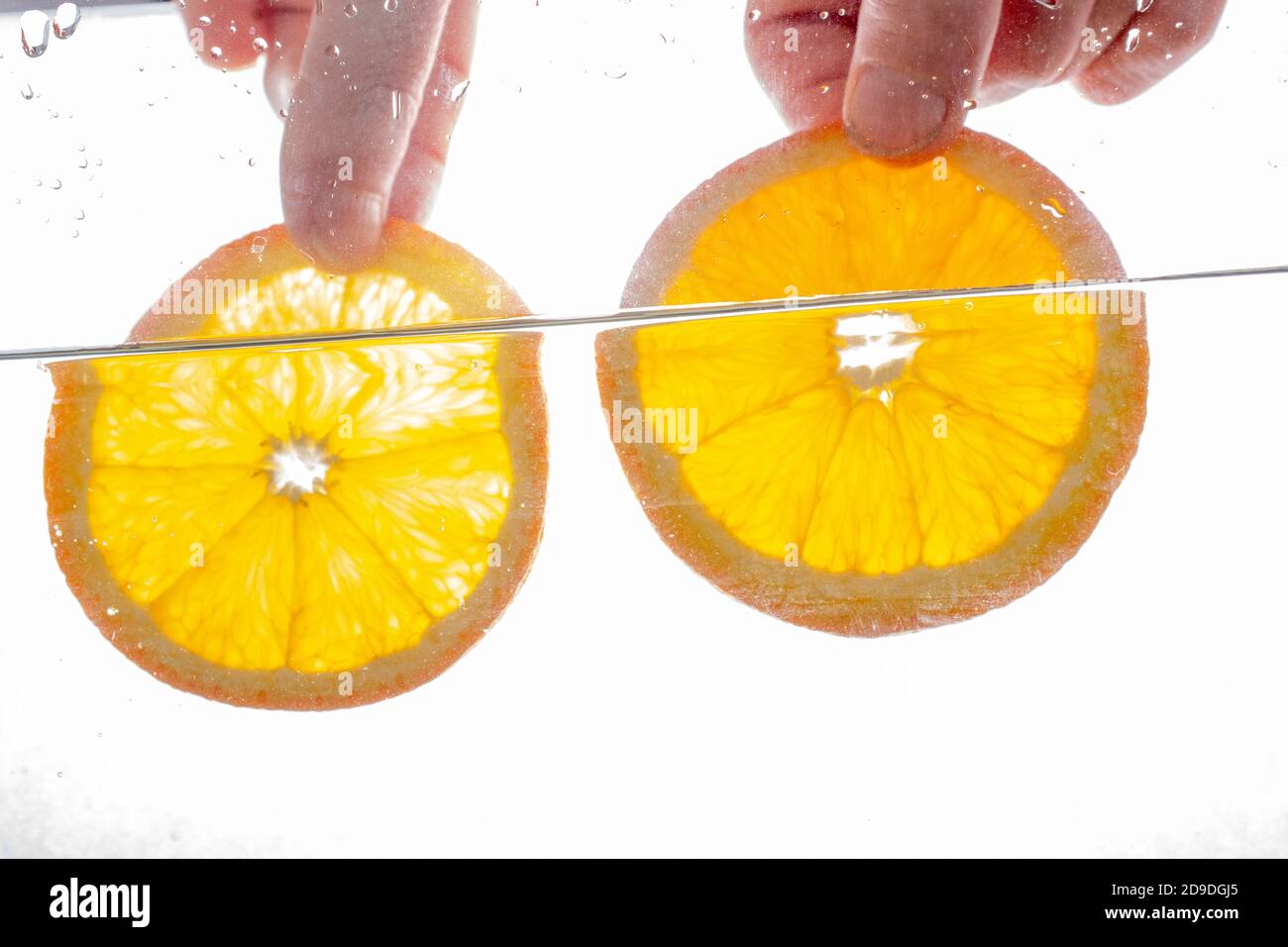 Dipping hands in water hi-res stock photography and images - Alamy