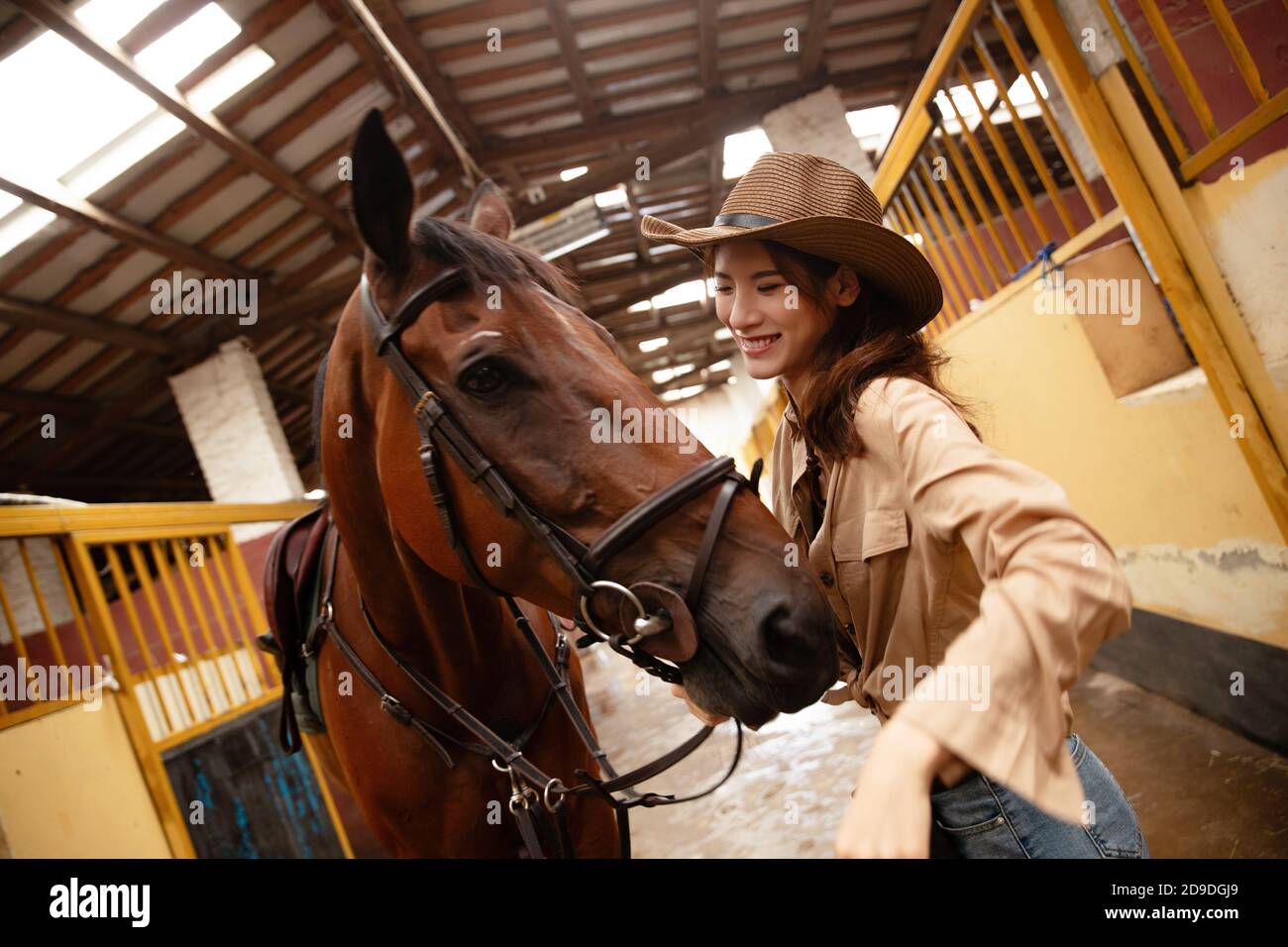 The stable happiness of young women and horses Stock Photo - Alamy