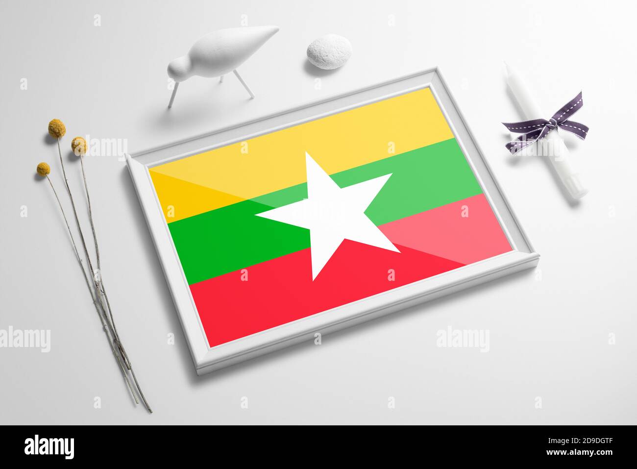 Myanmar flag in wooden frame on table. White natural soft concept ...