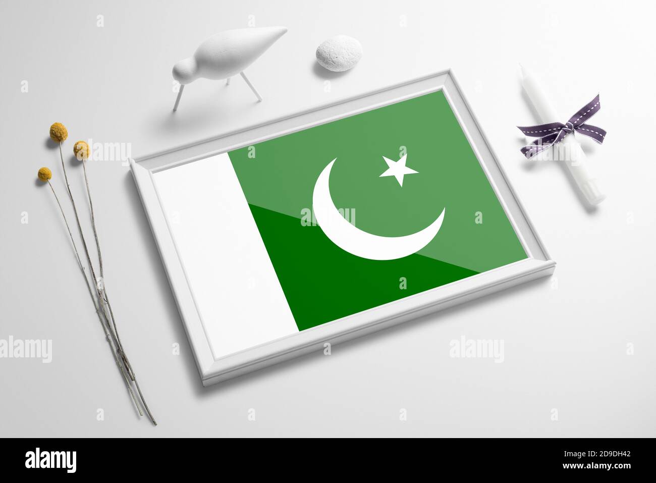 Pakistan flag in wooden frame on table. White natural soft concept ...