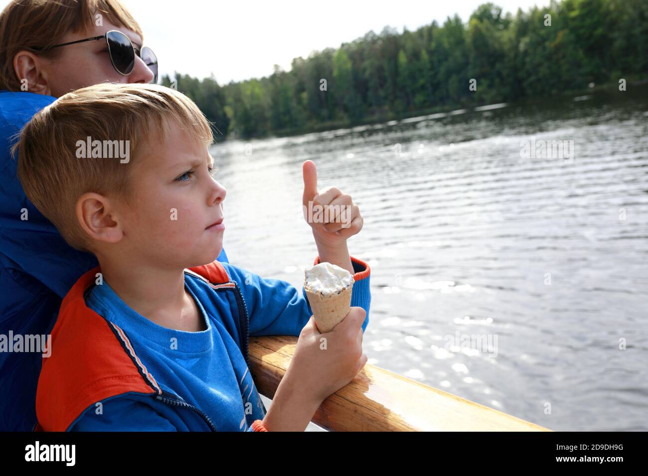 Boy eating ice cream on deck of passenger ship Stock Photo - Alamy