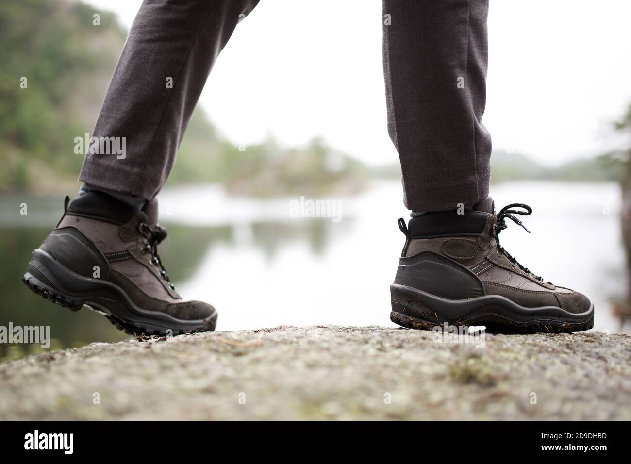Close up side portrait hiker walking in boots on rock Stock Photo - Alamy
