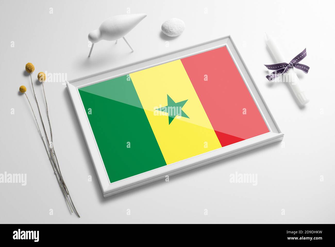 Senegal flag in wooden frame on table. White natural soft concept ...