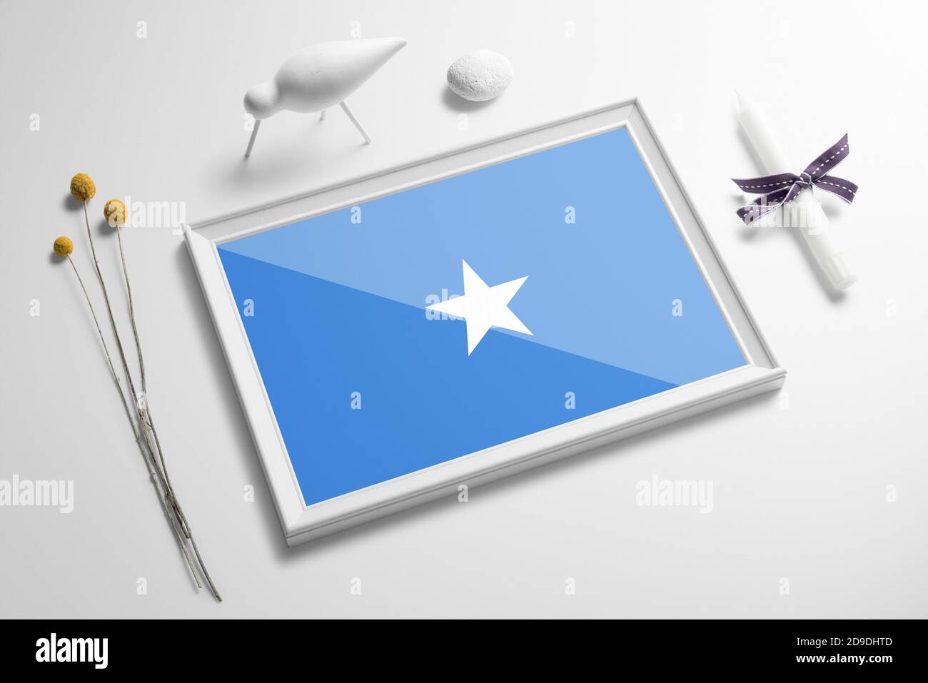 Somalia flag in wooden frame on table. White natural soft concept ...