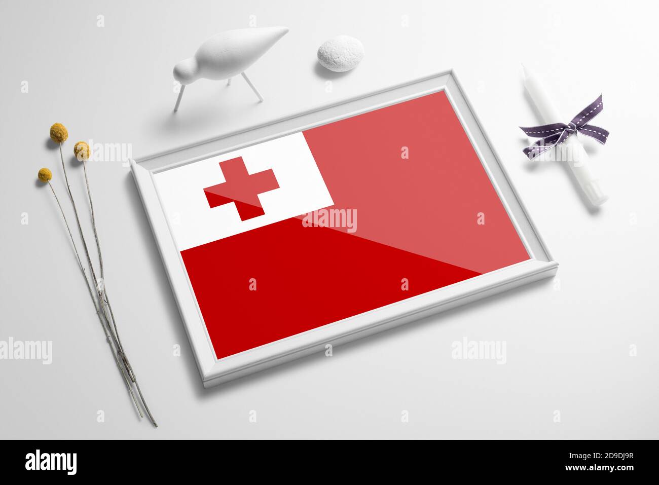 Tonga flag in wooden frame on table. White natural soft concept ...