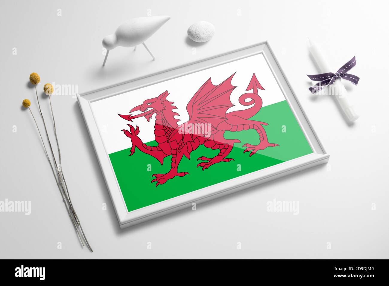 Wales flag in wooden frame on table. White natural soft concept ...
