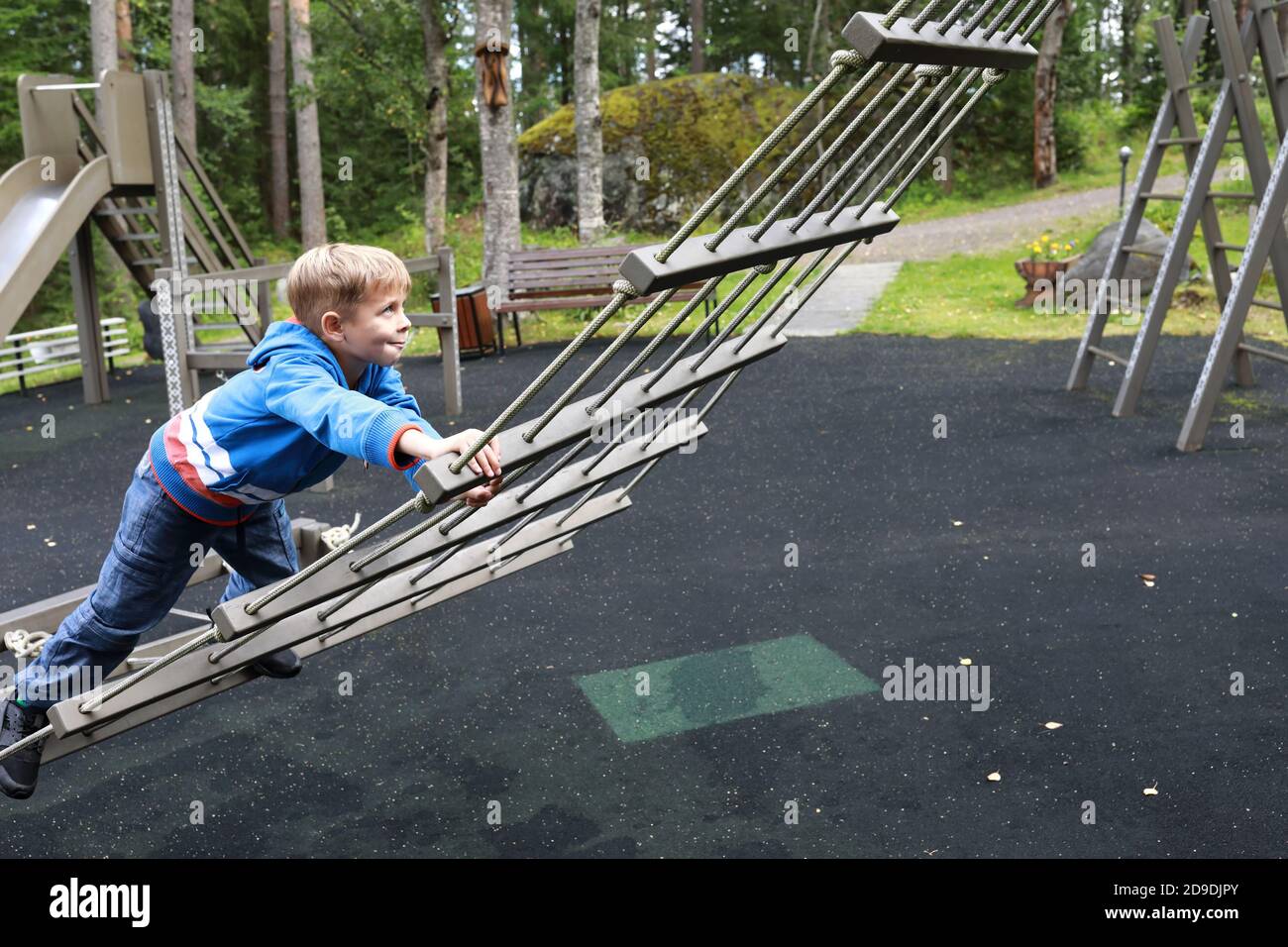 Boy climbing steps ladder hi-res stock photography and images - Alamy