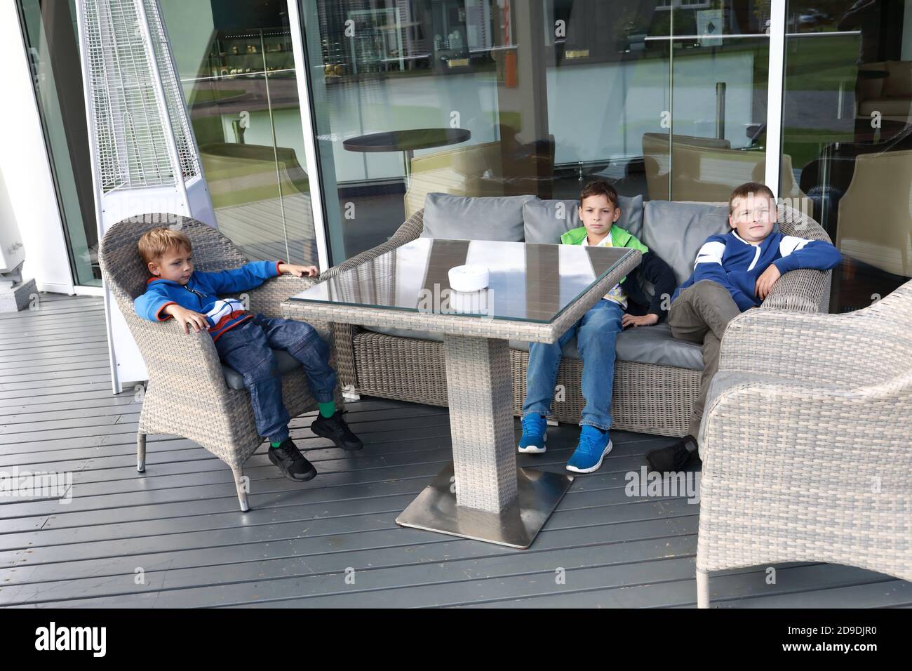 Children waiting food in outdoor cafe in summer Stock Photo - Alamy