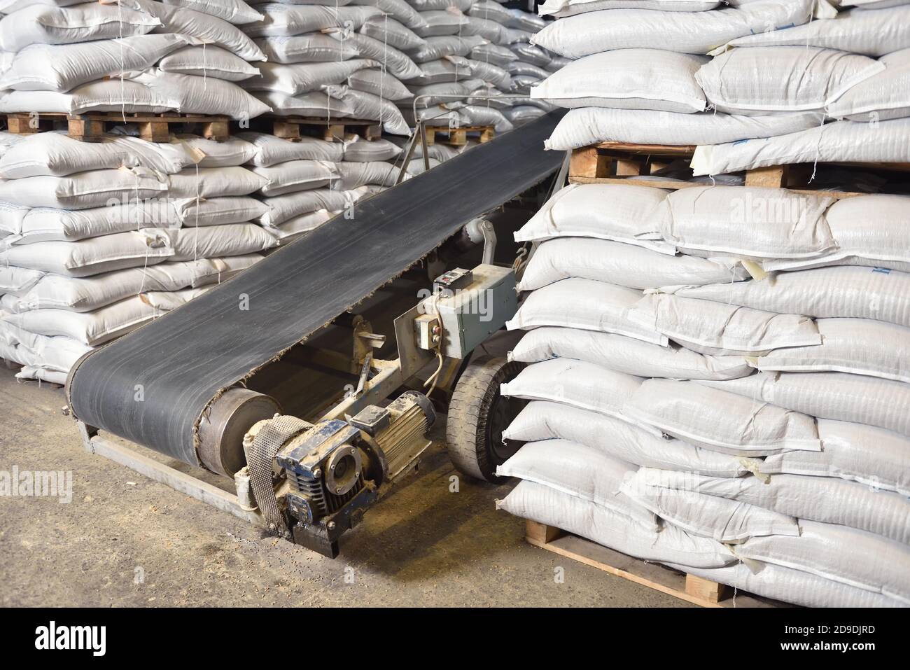 Conveyor belt for moving goods in a warehouse Stock Photo - Alamy