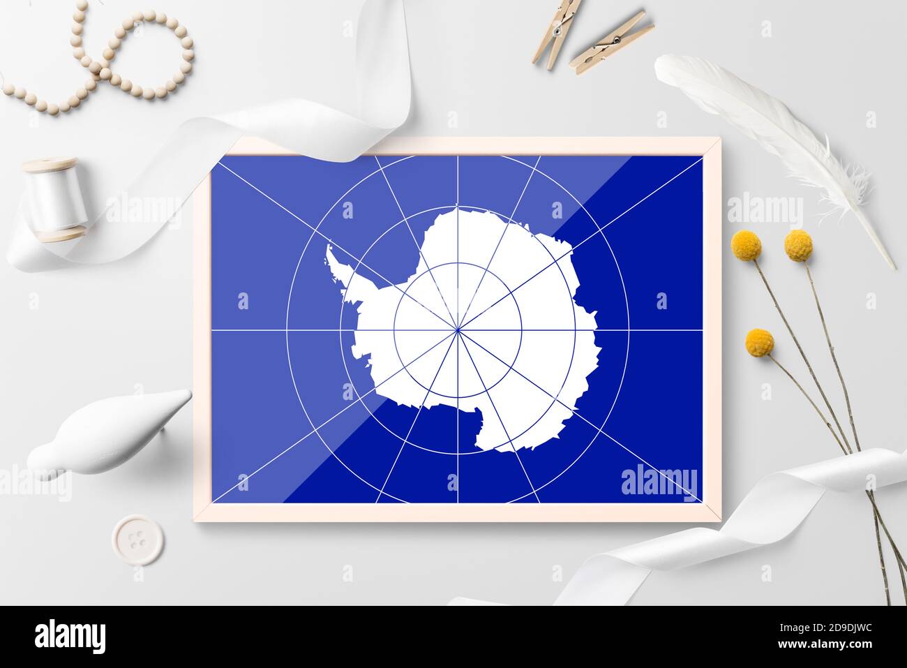 Antarctica flag in wooden frame on white creative background. White ...