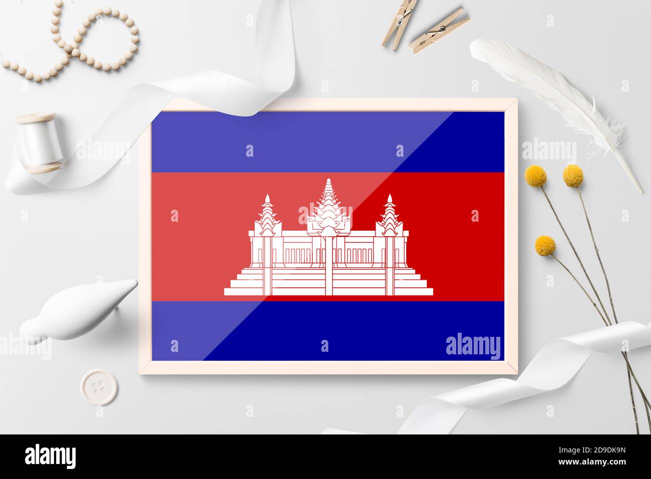 Cambodia flag in wooden frame on white creative background. White theme ...