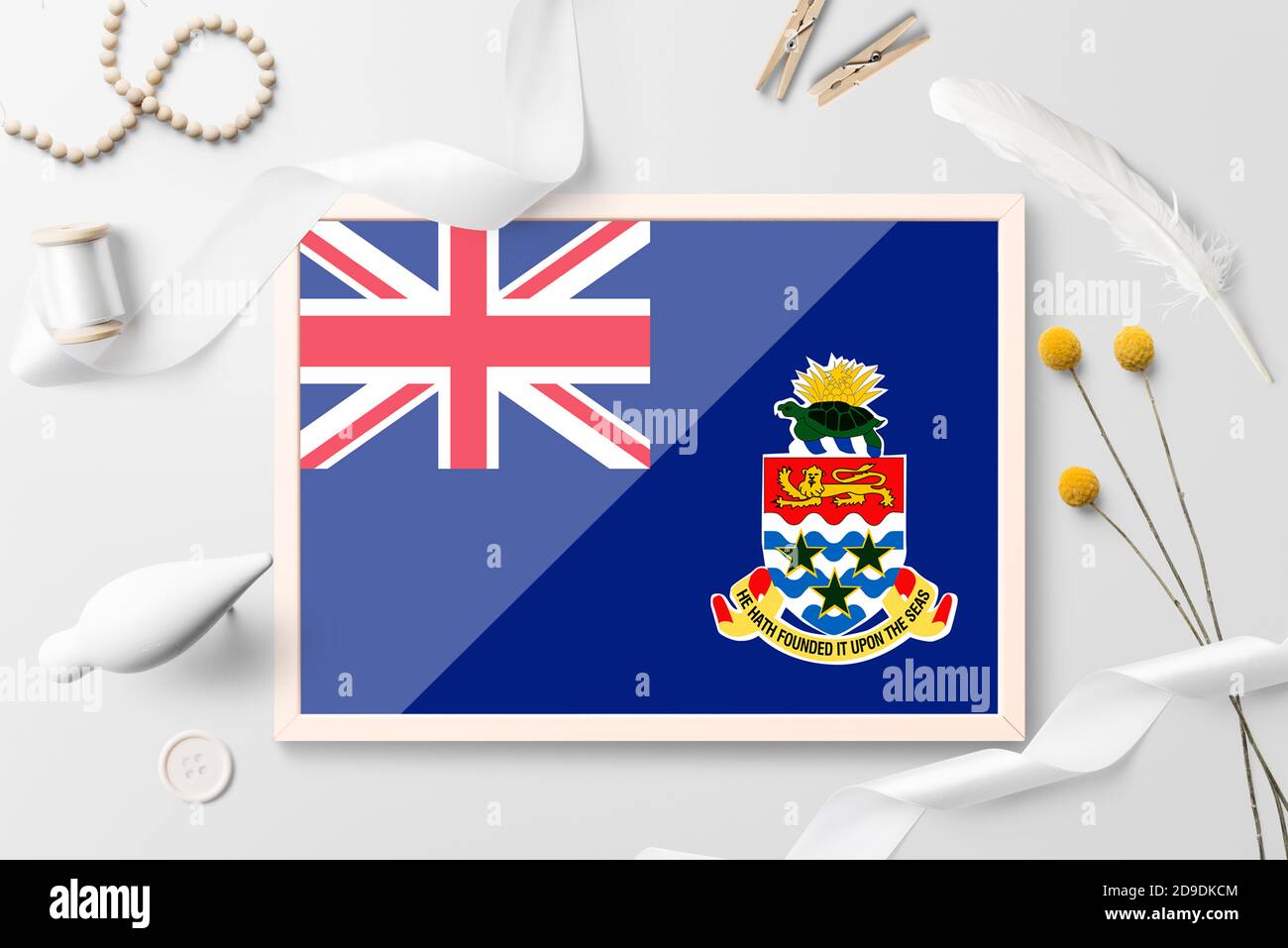 Cayman Islands flag in wooden frame on white creative background. White ...