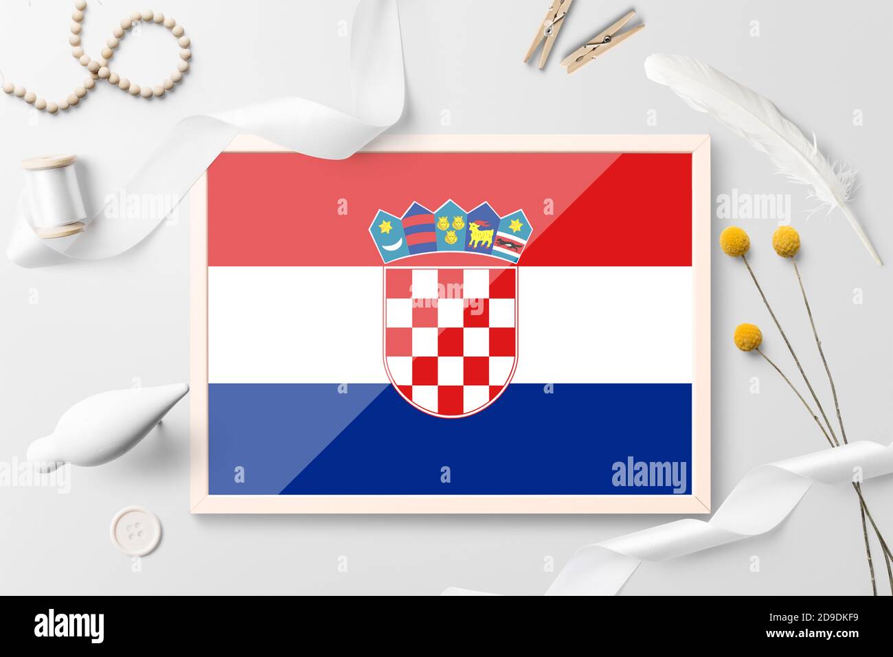 Croatia flag in wooden frame on white creative background. White theme ...