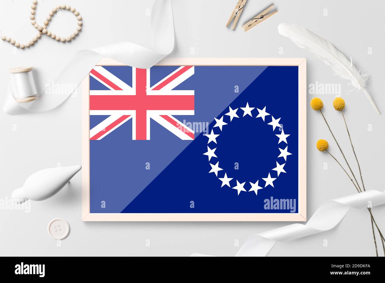 Cook Islands flag in wooden frame on white creative background. White ...