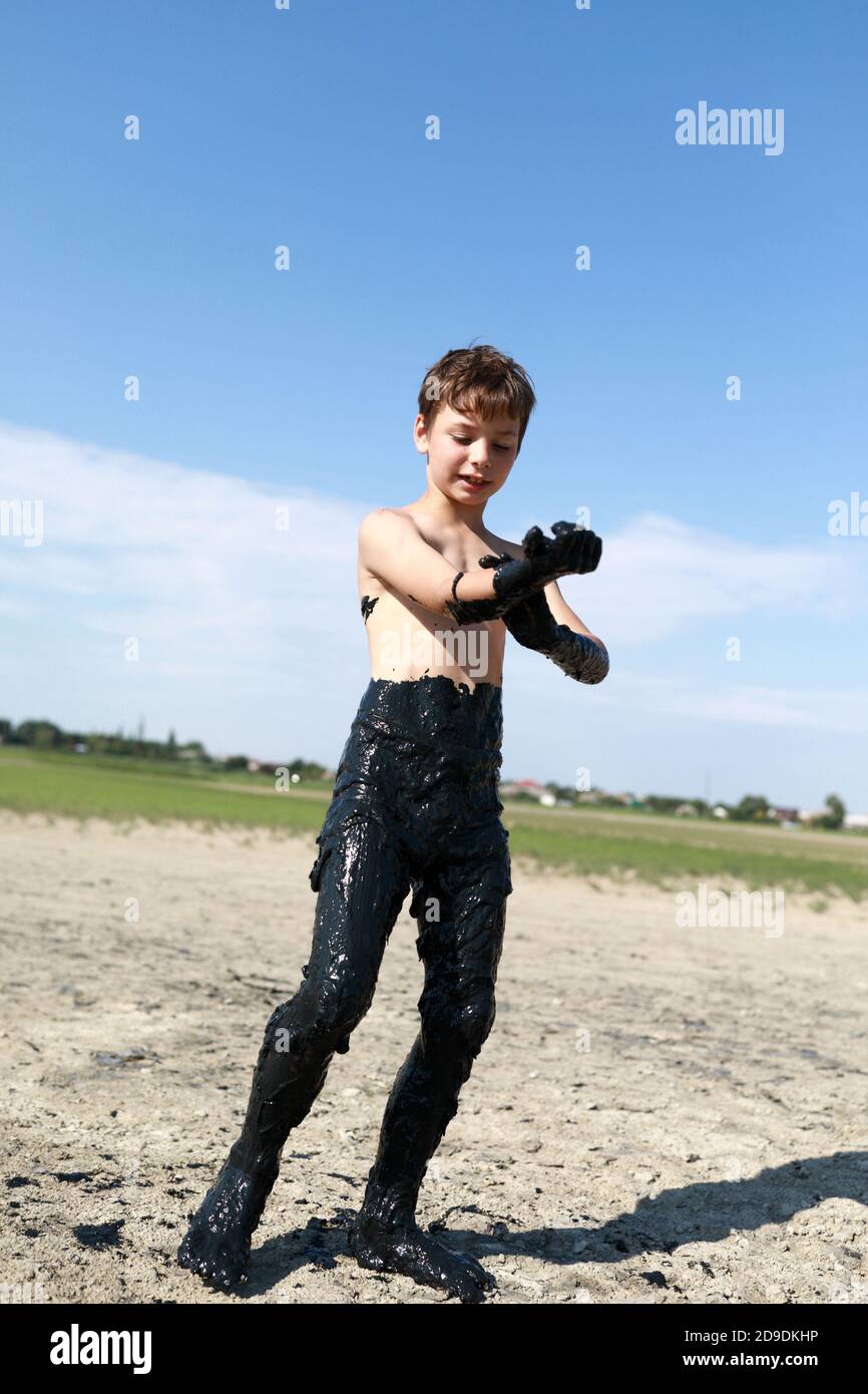 Boy covered mud hi-res stock photography and images - Alamy