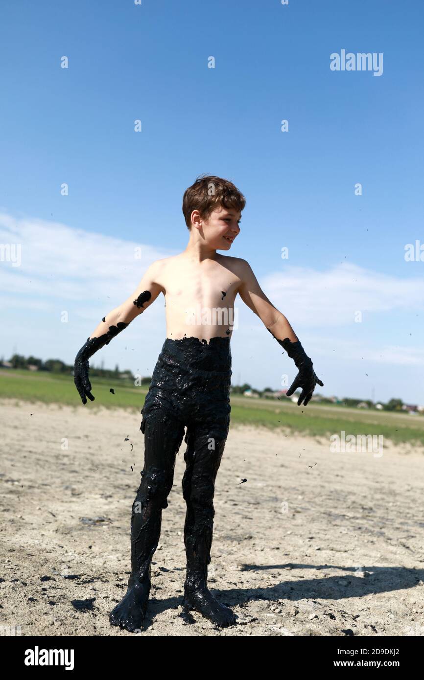 Boy covered mud hi-res stock photography and images - Alamy