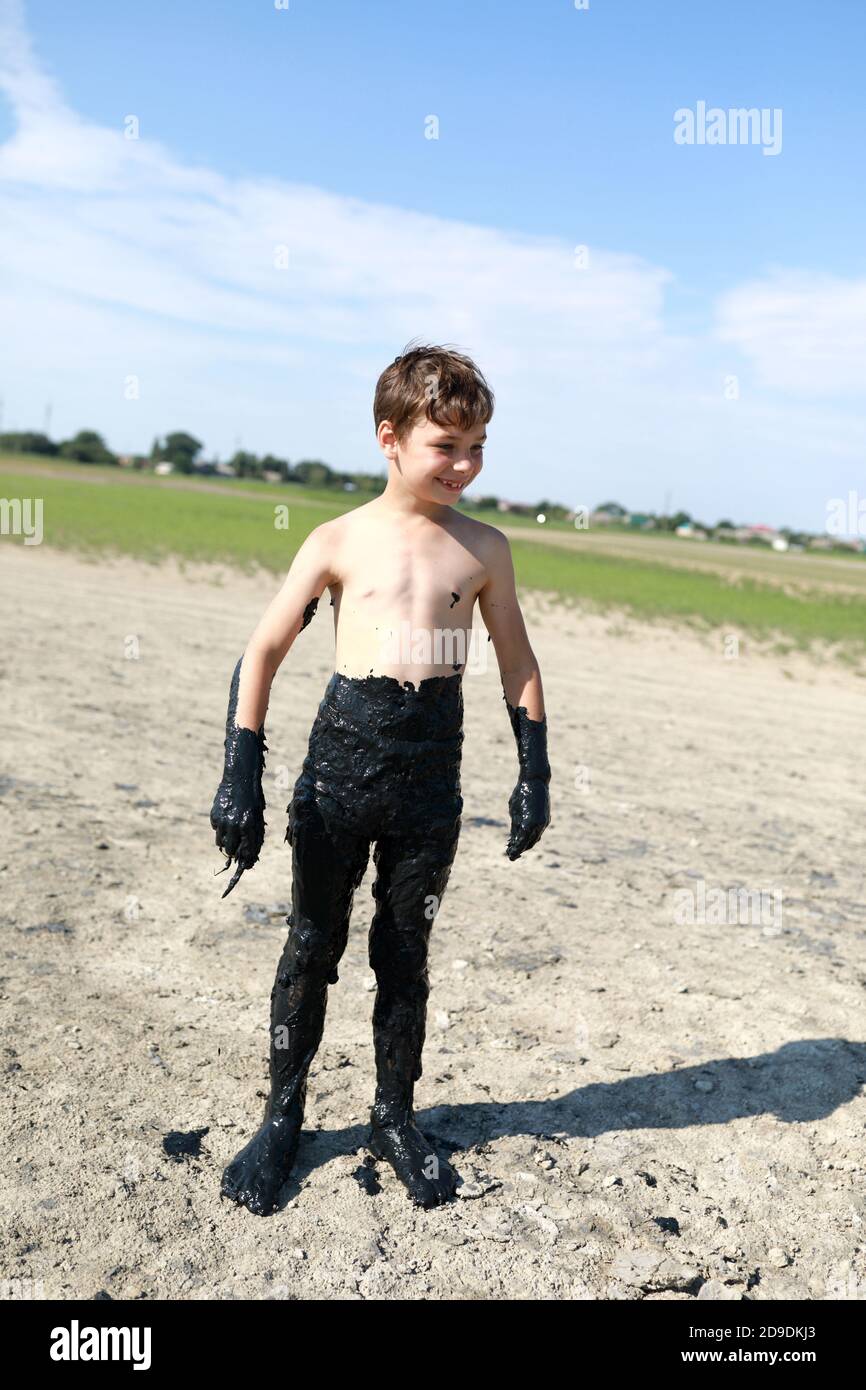 Child covered in mud hi-res stock photography and images - Alamy