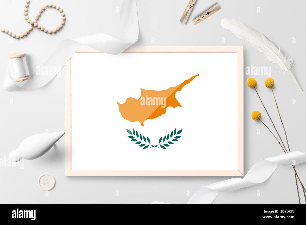 Cyprus flag in wooden frame on white creative background. White theme ...
