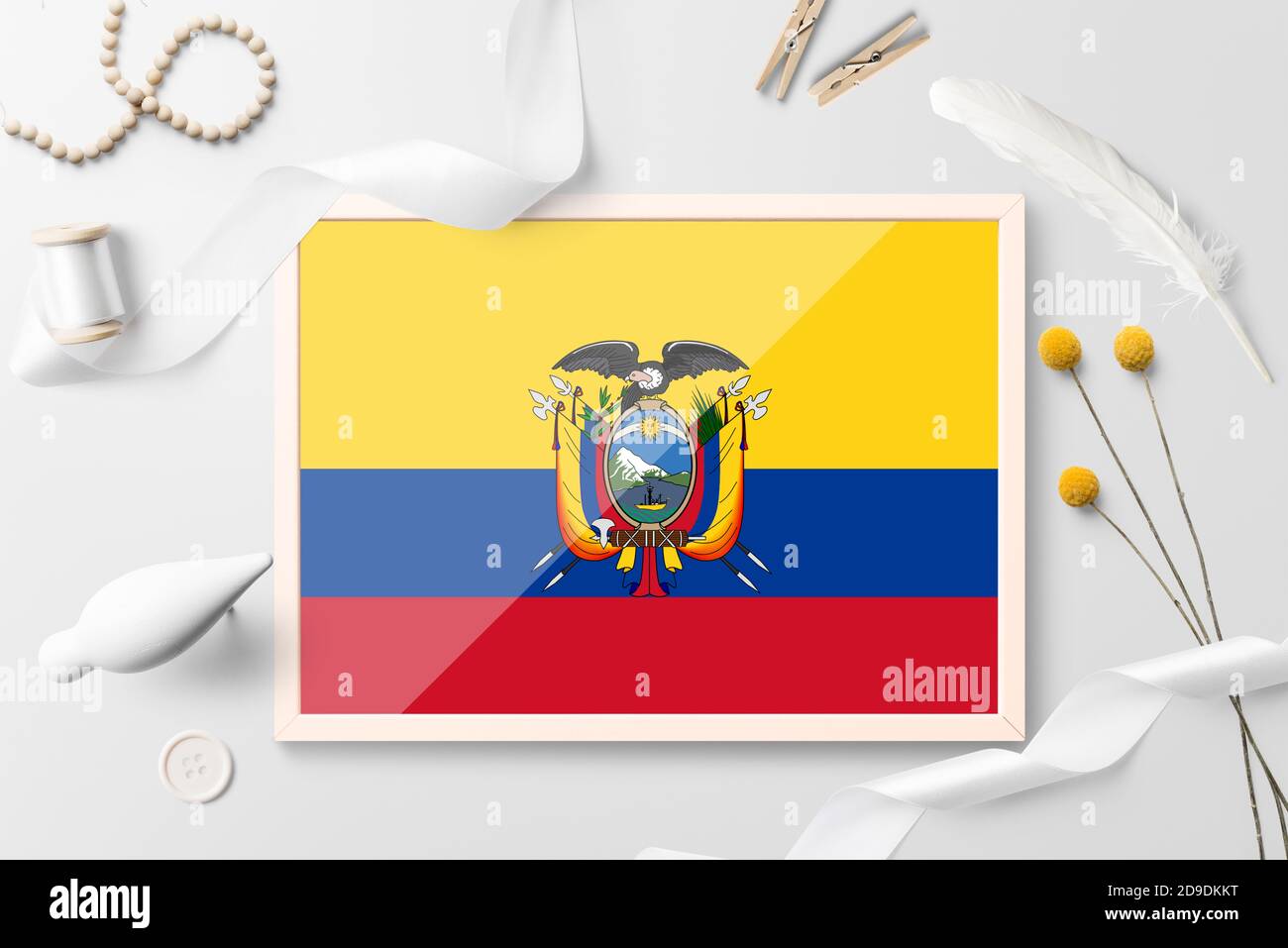 Ecuador flag in wooden frame on white creative background. White theme ...