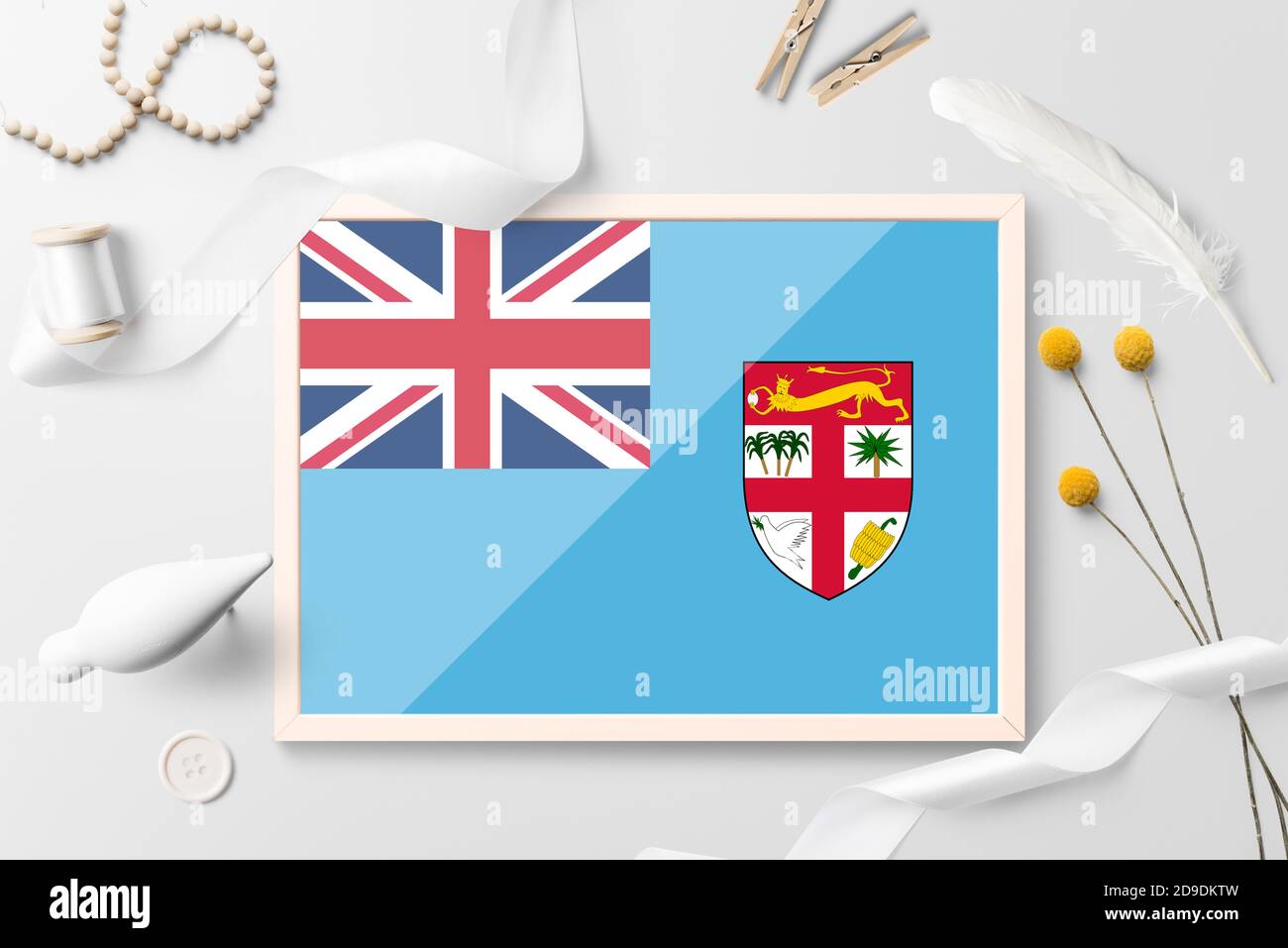 Fiji flag in wooden frame on white creative background. White theme ...