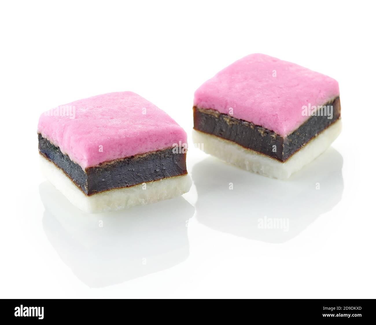 two pink candies with licorice isolated on white background Stock Photo ...